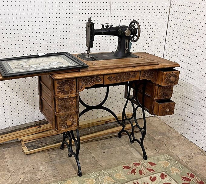This isn't just a sewing machine; it's industrial revolution meets craftsmanship in a wooden time capsule of American ingenuity.