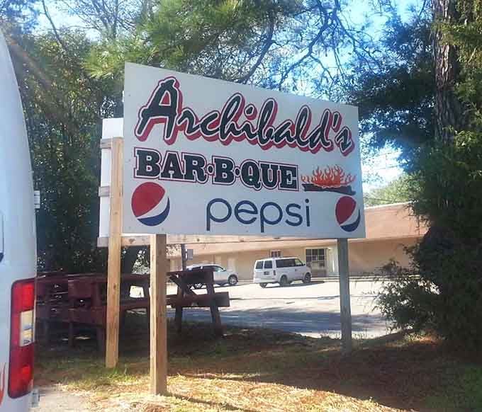A roadside sign that's been beckoning barbecue lovers for years, promising authentic flavors worth the stop every single time.