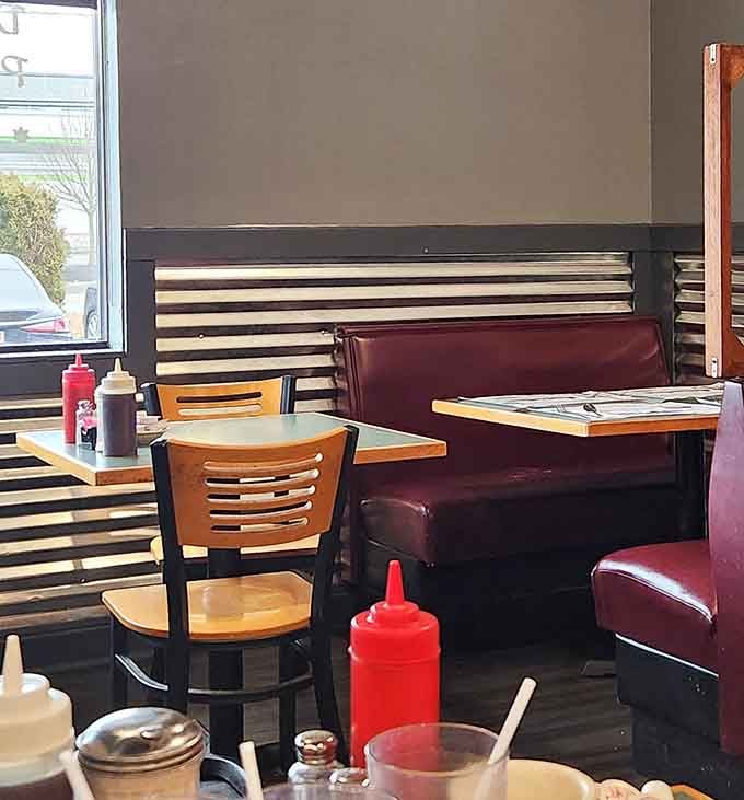 Booth seating with classic diner vibes, where red vinyl meets comfort and countless breakfast conversations have unfolded over the years.