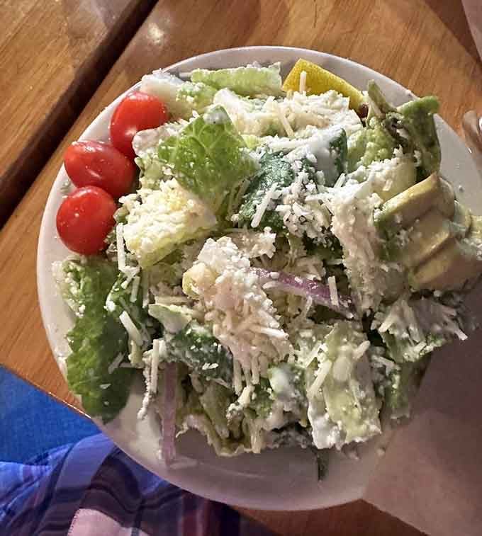 Even the salads come supersized. Fresh, crisp, and loaded with enough toppings to require architectural support and planning.