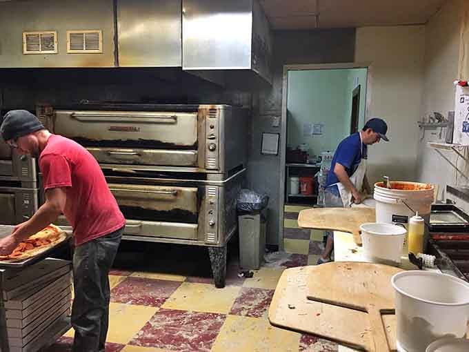 Where the magic happens: skilled hands turning dough into edible architecture that defies both gravity and common sense portion sizes.