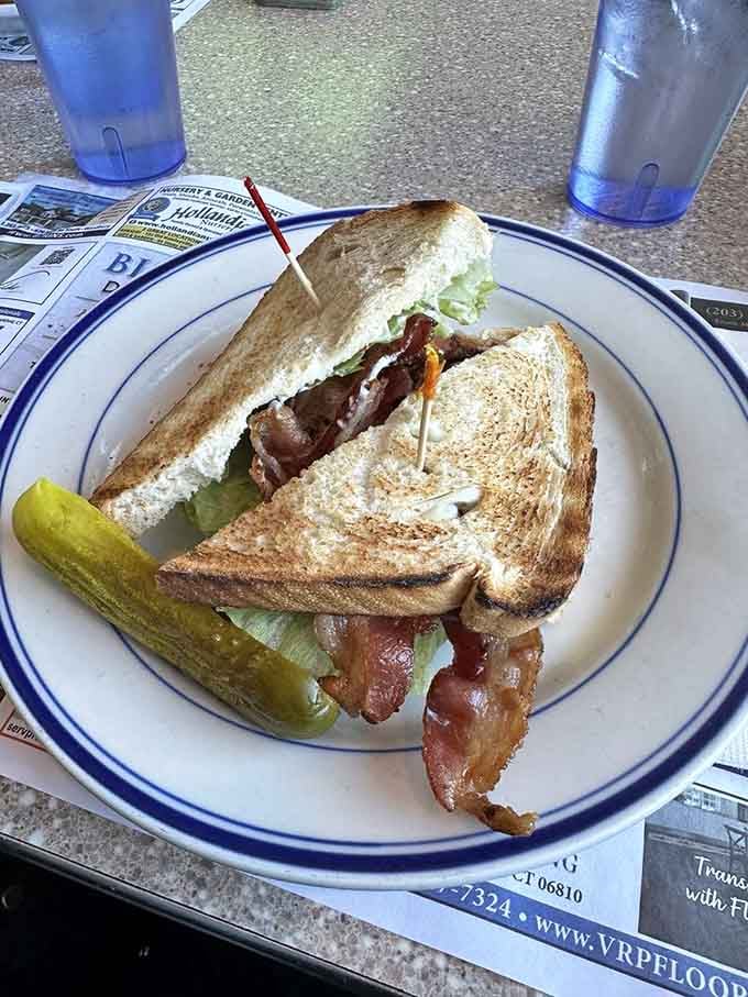 Classic BLT on toasted bread where crispy bacon is the undisputed star of this delicious triangle production.