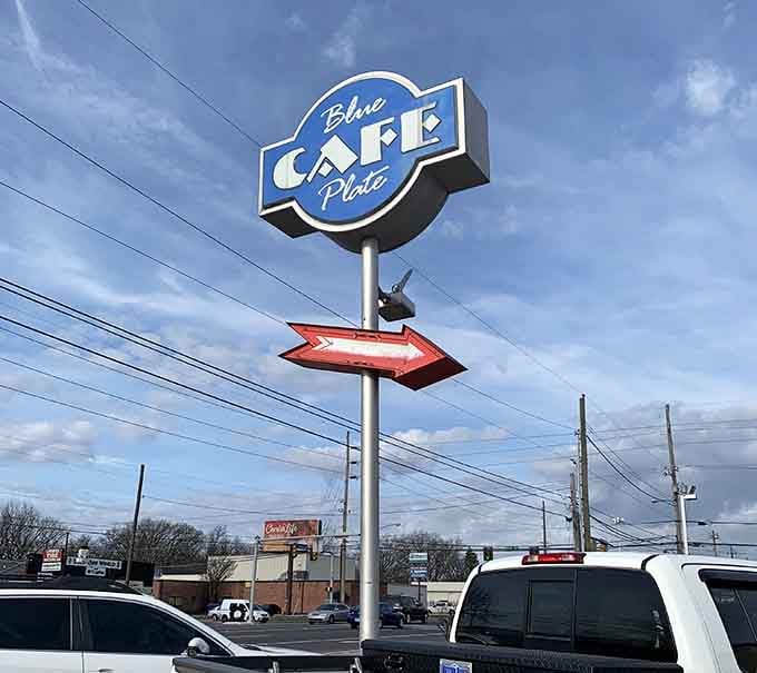 That retro sign with the arrow pointing the way is basically saying "This way to happiness, folks."