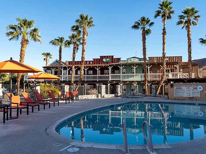 This sparkling pool surrounded by palm trees and Old West architecture makes desert living look pretty appealing.