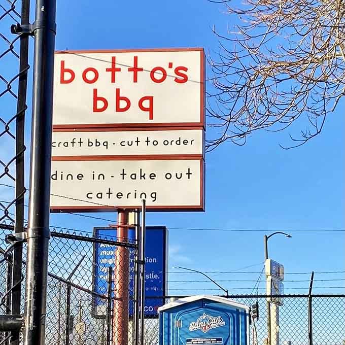 Their street sign promises craft barbecue cut to order, plus dine-in, takeout, and catering options galore.