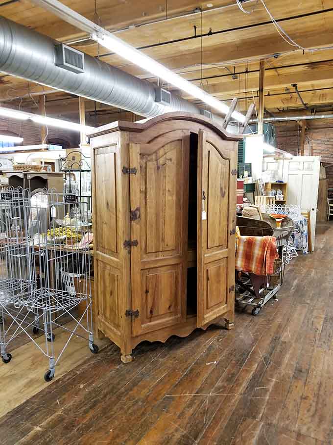 Solid wood armoire standing proud after decades, silently judging your flimsy particleboard furniture from big box stores.