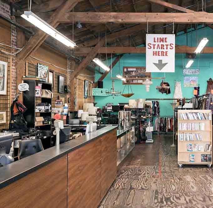 The checkout area with its "Line Starts Here" sign promises smooth transactions after your inevitable shopping spree through this wonderland.