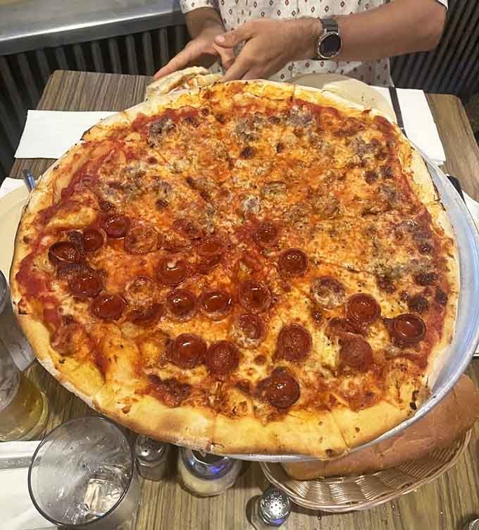 Half sausage, half pepperoni means never having to choose between two perfect toppings on one glorious pie together.