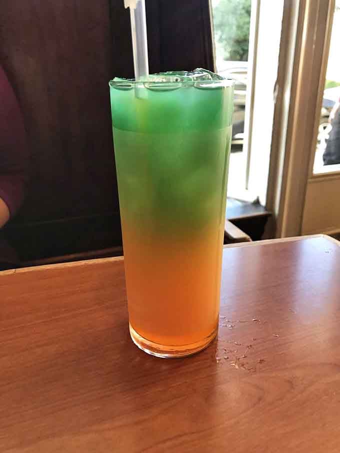 That gradient drink transitions from orange to green like a tropical sunset you can actually sip through a straw.