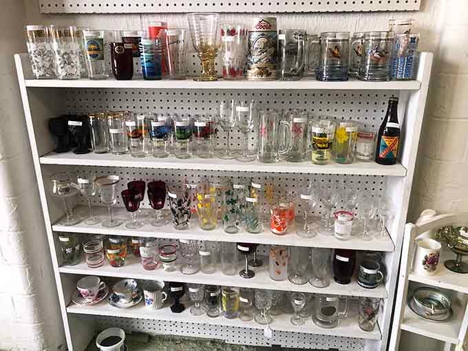 Glassware collections spanning decades, from beer steins to wine goblets, each piece representing someone's favorite toast or celebration.
