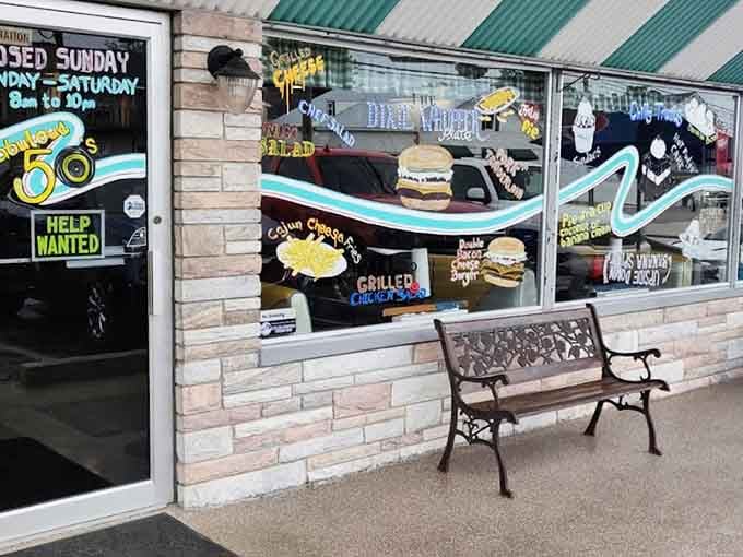 Colorful window displays and a welcoming bench invite you to sit a spell before diving into diner heaven.