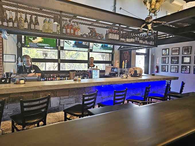 The bar area glows with blue lighting, creating an atmosphere that's part lounge, part time machine.