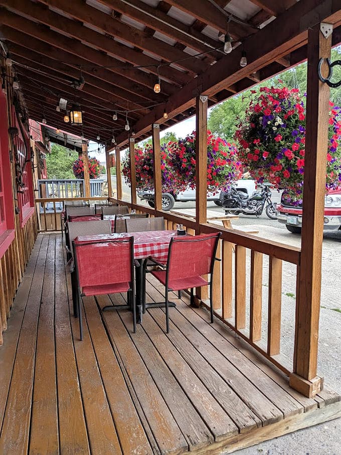 Covered patio seating with those flower baskets overhead makes al fresco dining feel like a special occasion every time.