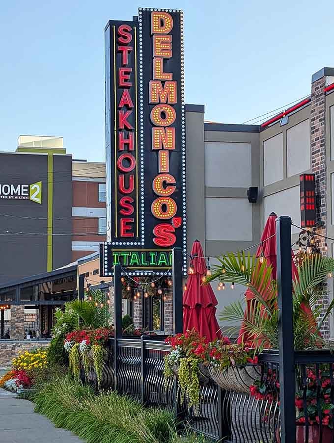 Delmonico's Italian Steakhouse sign glows like a beacon for the hungry. Those neon lights are basically saying "Yes, we have enough garlic in everything."