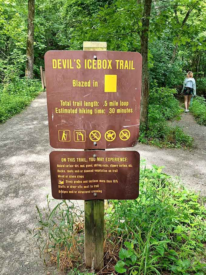 This trail sign promises adventure in just half a mile, which is basically nature's version of instant gratification.