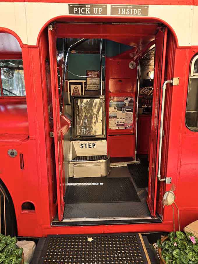 The welcoming entrance invites you to step aboard this red beauty and discover what coffee tastes like on a bus.