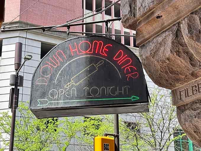 The vintage-style outdoor sign points the way to comfort food heaven, open tonight and ready for you.