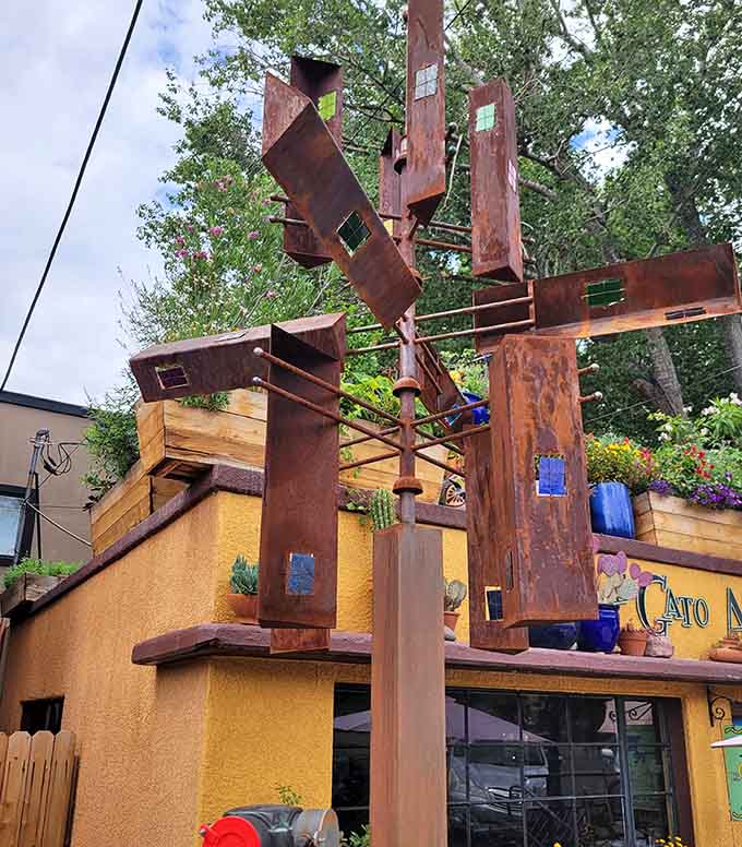 Whimsical outdoor sculpture adds artistic flair to the patio, proving this place values creativity in decor and cuisine.