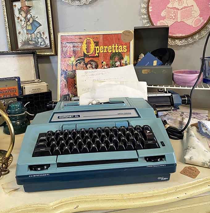 An electric typewriter that once seemed cutting-edge, now sitting peacefully among relics of pre-digital productivity and patience.