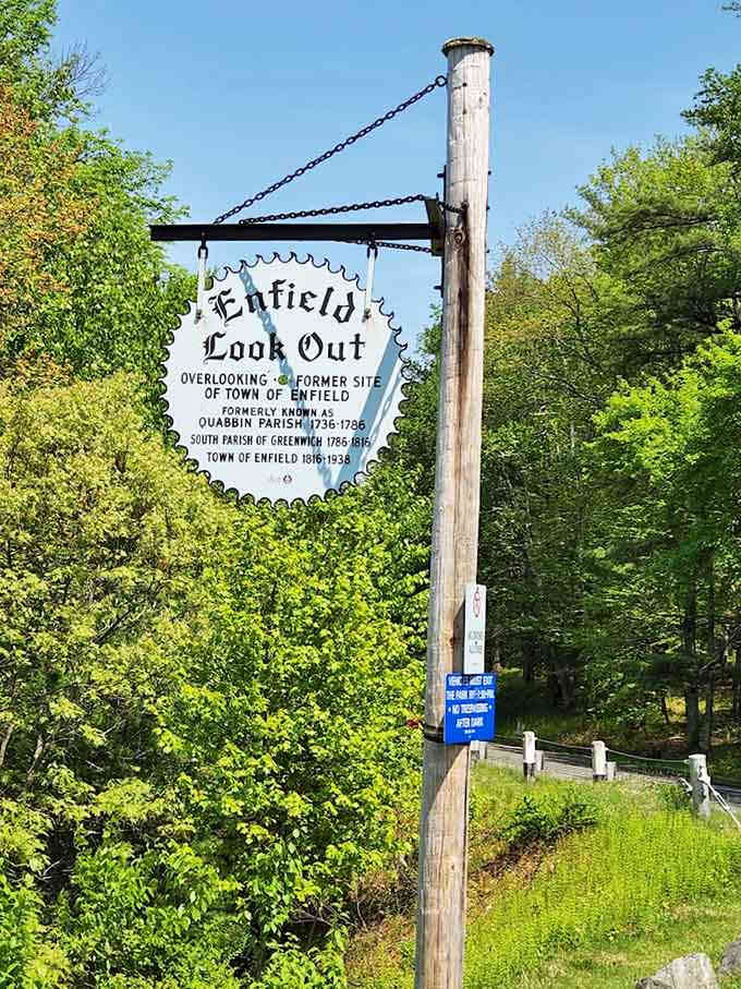 The Enfield Lookout sign marks your arrival at a view that cameras struggle to capture adequately.