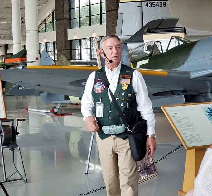 This knowledgeable docent shares stories that transform cold metal into living history, connecting past heroism with present wonder.