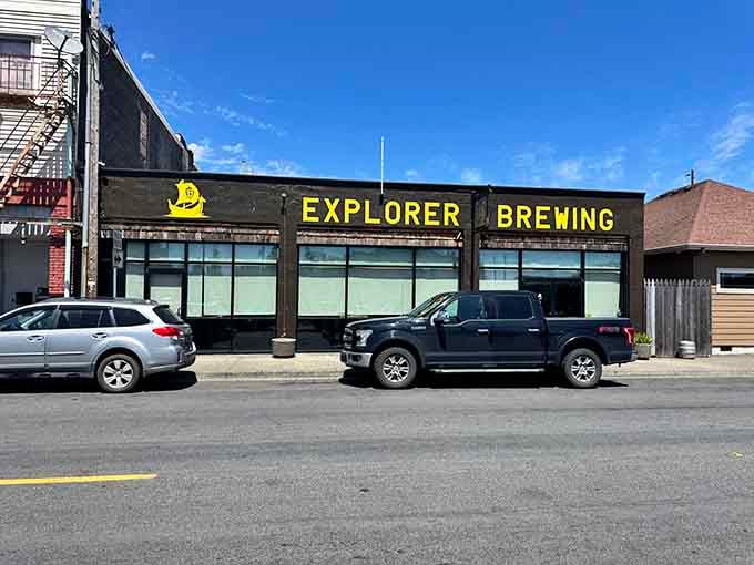 Bold yellow letters announce craft brewing done right, where local flavors flow as freely as the conversation inside.