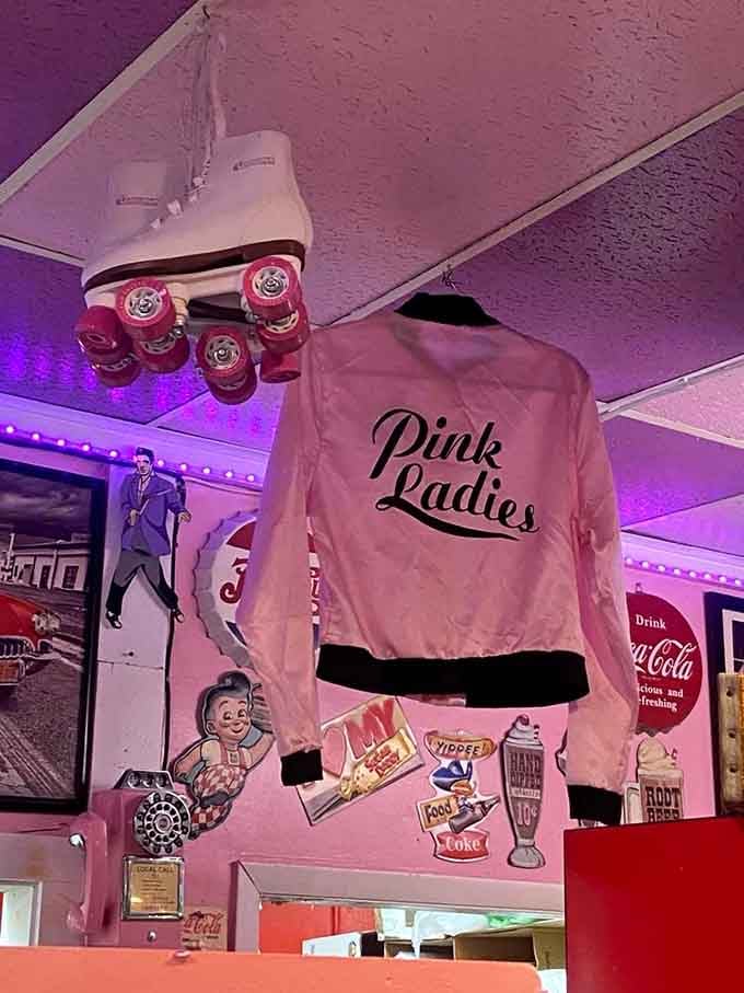 A Pink Ladies jacket and roller skates hanging overhead remind you that this place takes its theme seriously and joyfully.