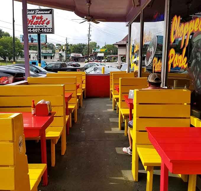 Bright yellow outdoor seating adds a cheerful pop of color for those who prefer their ribs with sunshine.