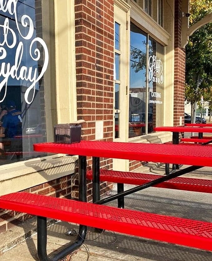 Red tables lined up like soldiers, ready to serve hungry folks seeking their BBQ fix today.