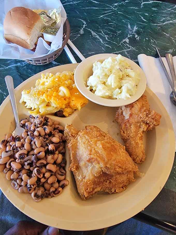 Golden fried chicken with all the Southern sides, proving that comfort food done right never goes out of style, no matter the decade.