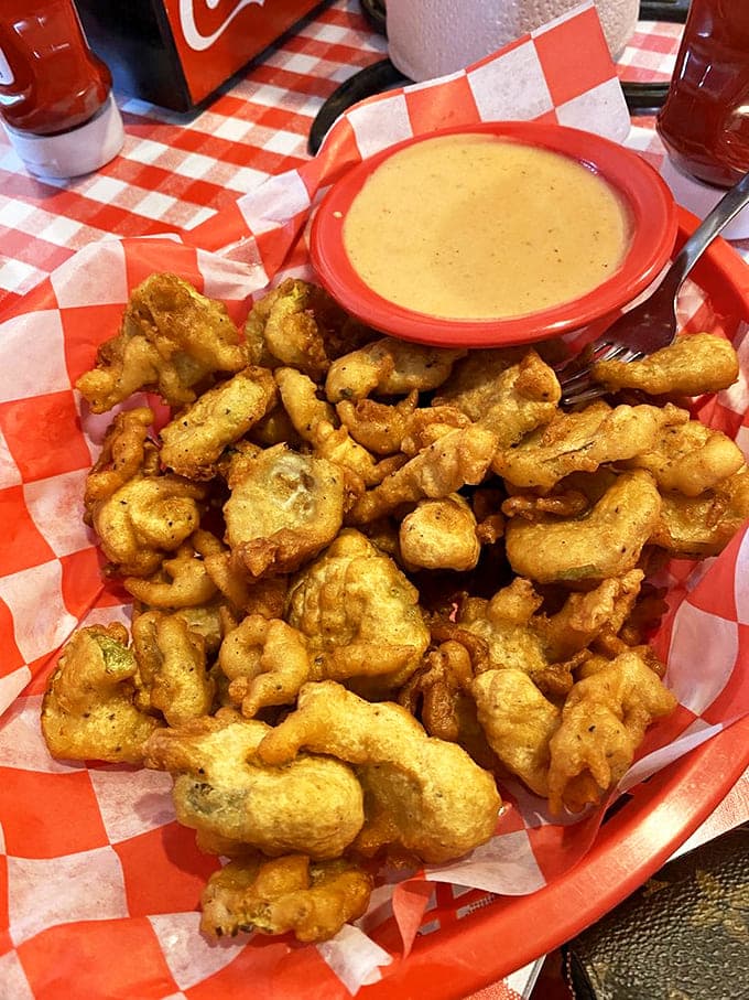 Fried pickles that crunch louder than your diet plans. That dipping sauce isn't just condiment&mdash;it's liquid gold for your taste buds.
