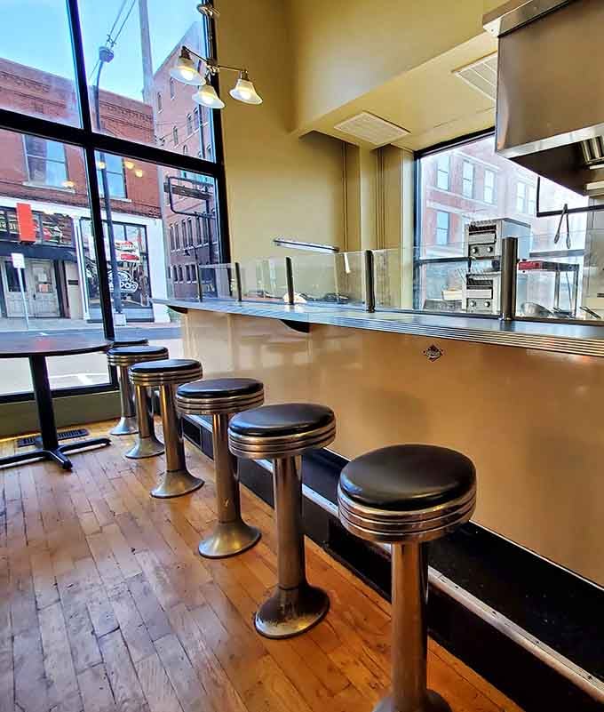 Window-side counter seats offering prime real estate for watching downtown Springfield wake up with your coffee.