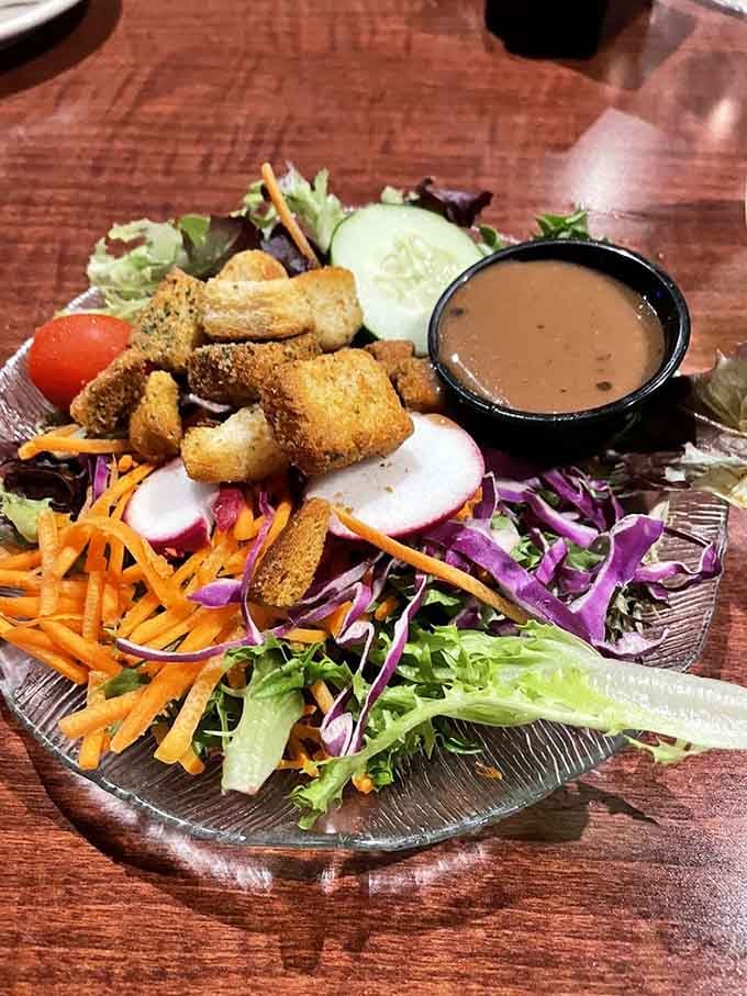 A garden salad that doesn't apologize for being healthy, dressed in a vinaigrette that makes raw vegetables feel like a reward, not a punishment.