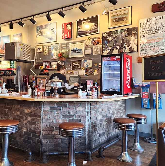 The counter seating adorned with vintage memorabilia offers front-row seats to breakfast theater in action.