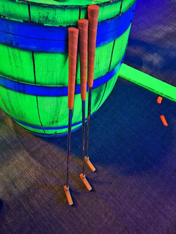 These glowing putters look like they were borrowed from a very organized intergalactic golf tournament.