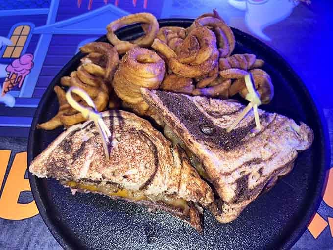 The Secret Potion Patty Melt arrives with spiral fries, because regular fries would be far too ordinary for this menu.