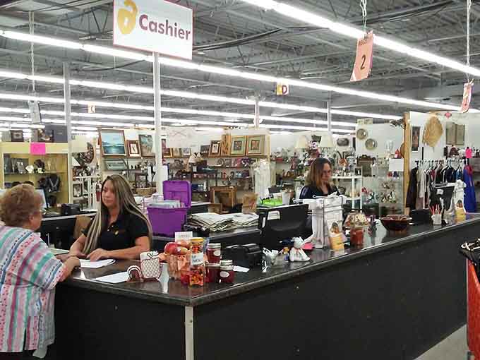 The checkout counter where your "just browsing" promise goes to die, surrounded by evidence of your excellent treasure hunting skills.