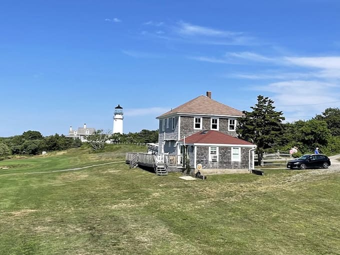 The distant view captures Highland Light's commanding presence on the bluffs, a sentinel watching over the Atlantic.