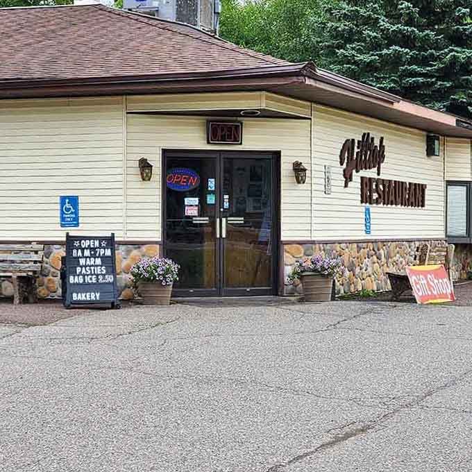 Purple flowers frame the entrance, welcoming hungry travelers to discover what locals have known for years now.