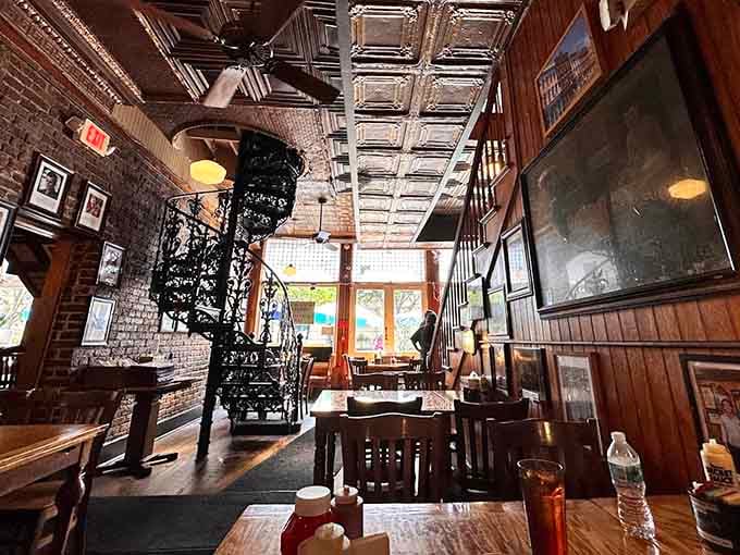 Tin ceiling tiles and wooden chairs create that timeless atmosphere where good food feels even better somehow.