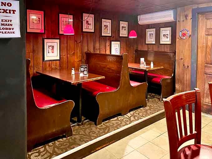 Cozy booths with red vinyl seating invite lingering conversations and second rounds of whatever you just devoured.