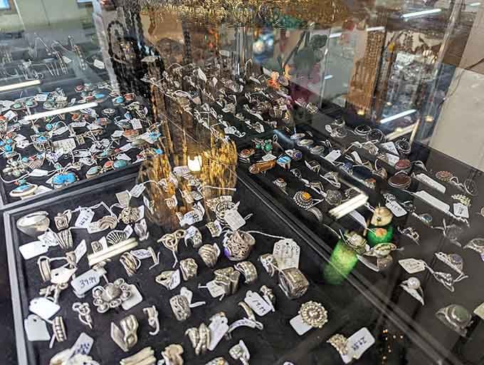 Vintage jewelry sparkling under glass, each piece holding stories of romance, celebration, and someone's very good taste in accessories.