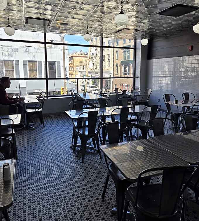Sunlight streams through windows onto penny tile floors, illuminating the path to your next favorite meal in Philadelphia.