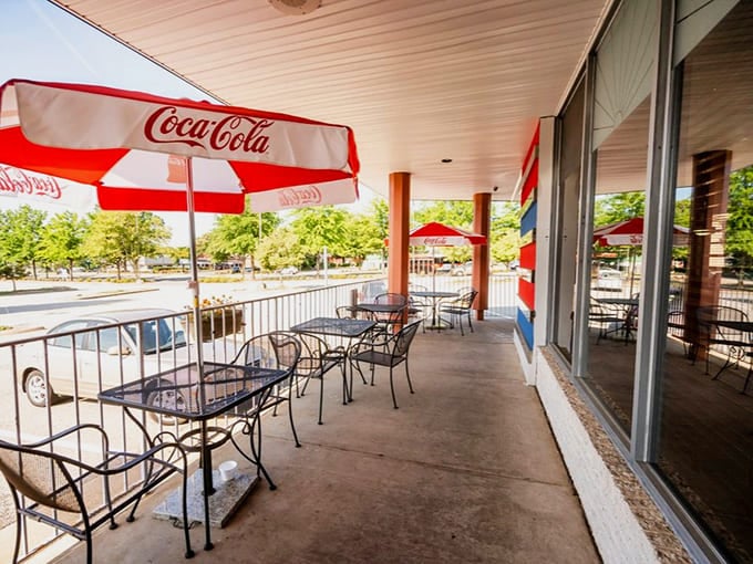 Outdoor seating under Coca-Cola umbrellas turns any meal into a mini vacation without leaving Northern Virginia behind.