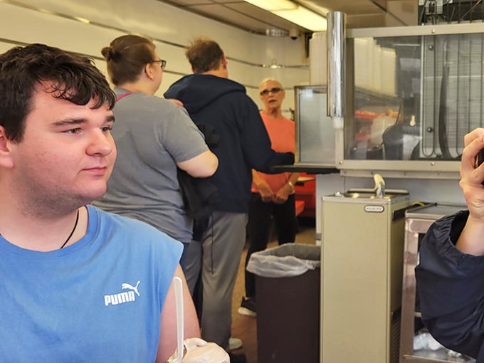 Happy diners enjoying their meals at the counter, proving that good food brings people together across all ages.