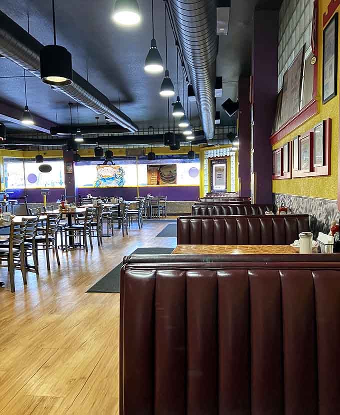 Brown leather booths and colorful walls create a dining space that's both comfortable and energizing at once.