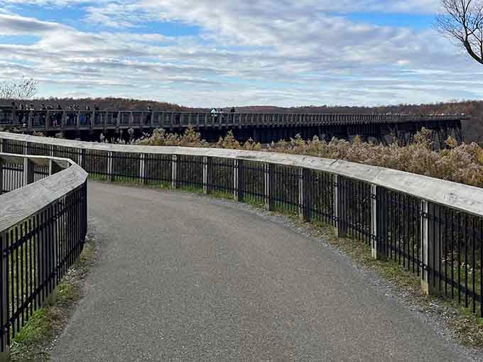 The curved walkway follows the original bridge path, leading you toward views that defy adequate description.