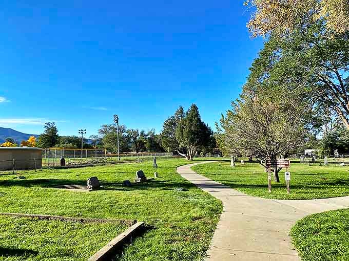 Kit Carson Park's winding paths invite contemplative strolls where the mountain air seems to carry whispers of the town's colorful history.