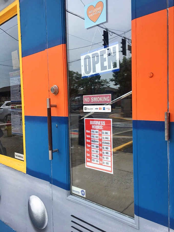 Business hours posted clearly so you can plan your intergalactic sandwich adventure without any surprises.