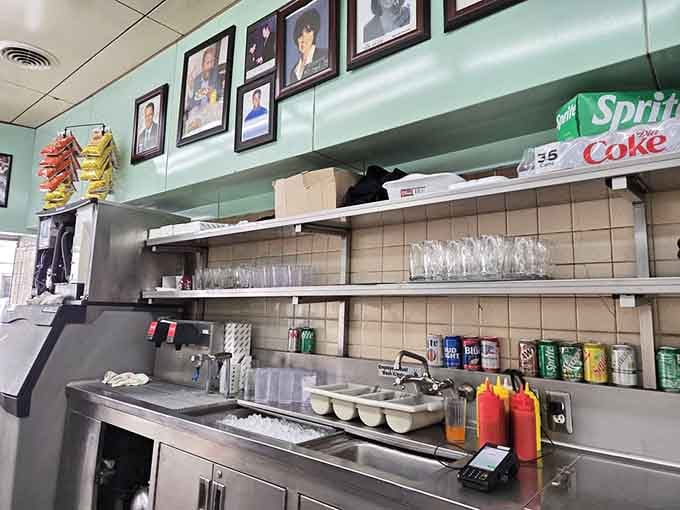 Behind the counter, condiments and supplies stand ready for the next rush of hungry coney enthusiasts seeking perfection.